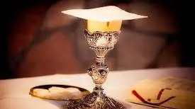 They try to poison the priest by putting bleach in his wine glass: the ...
